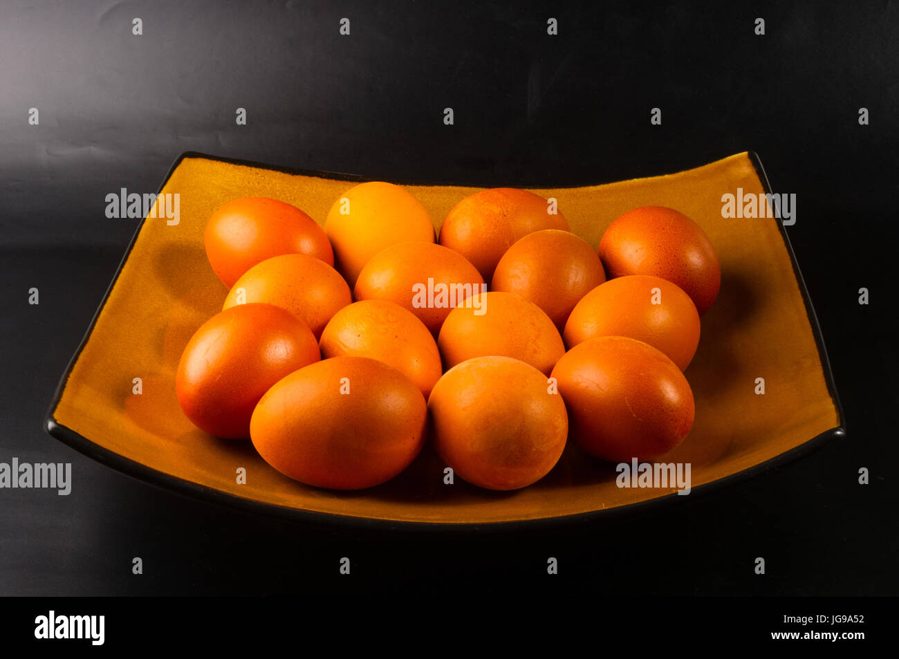 eggs colored with natural dye on brown dish Stock Photo - Alamy