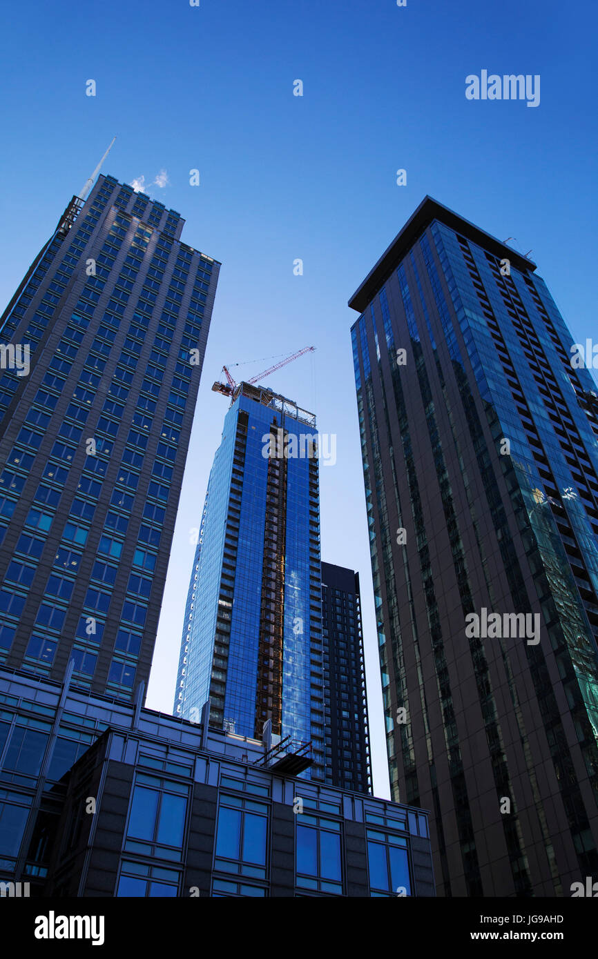 Construction on high-rise buildings in downtown Montreal, Canada. A ...