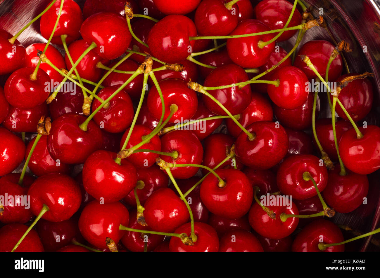 large ripe red cherries in a dish of stainless steel, close-up Stock ...