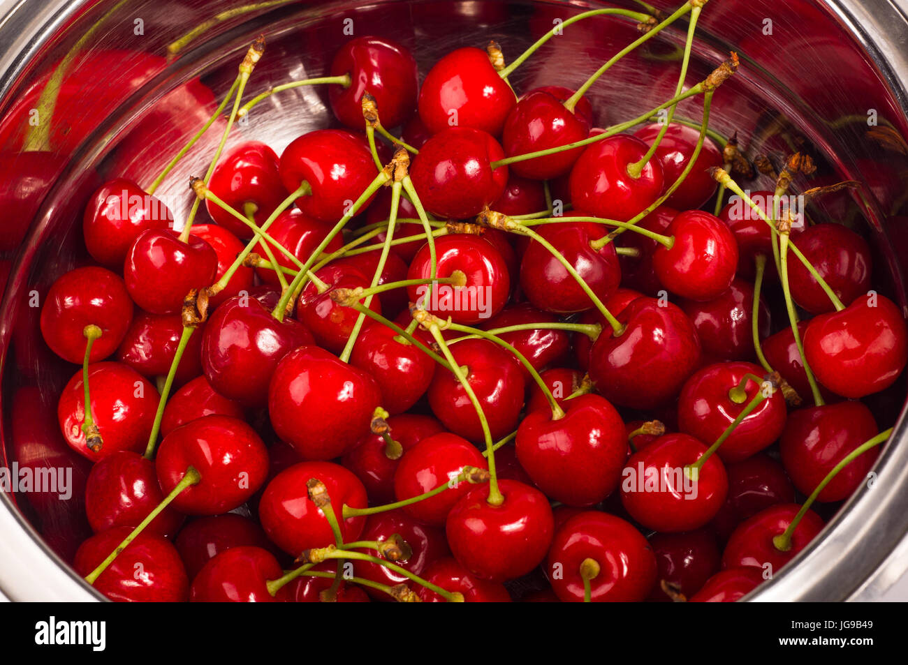 large ripe red cherries in a dish of stainless steel, close-up Stock ...