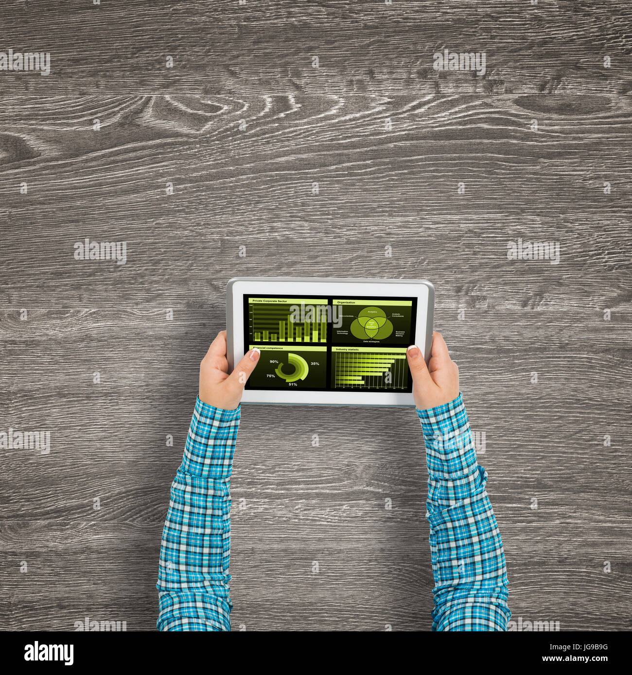 Top view of girl hands using tablet pc with diagrams and graphs on ...