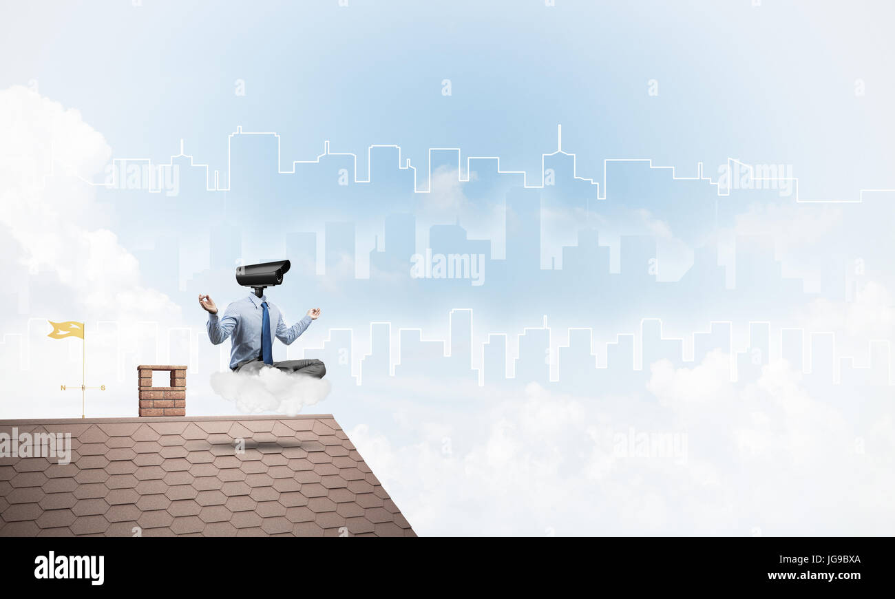 Faceless businessman with camera zoom instead of head sitting in lotus ...