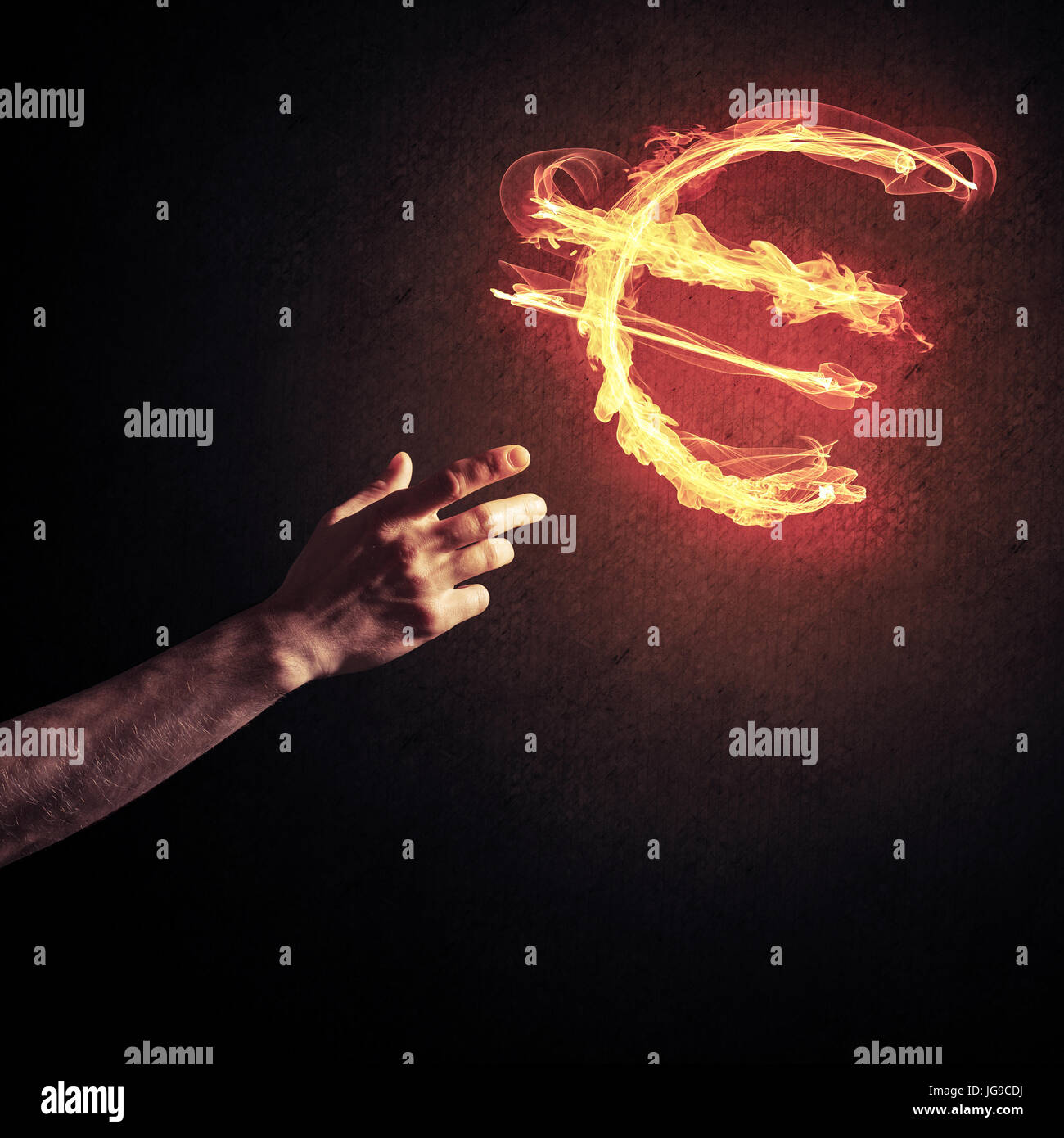 Close of man hands pointing at fire glowing euro sign Stock Photo - Alamy