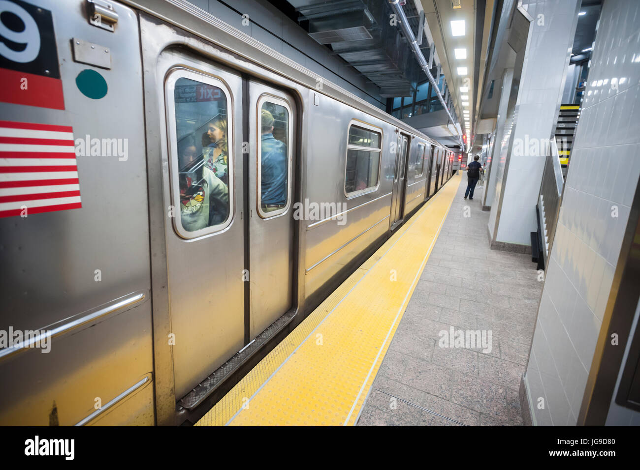 A crowded Number 1 train waits to depart the newly restored South Ferry ...