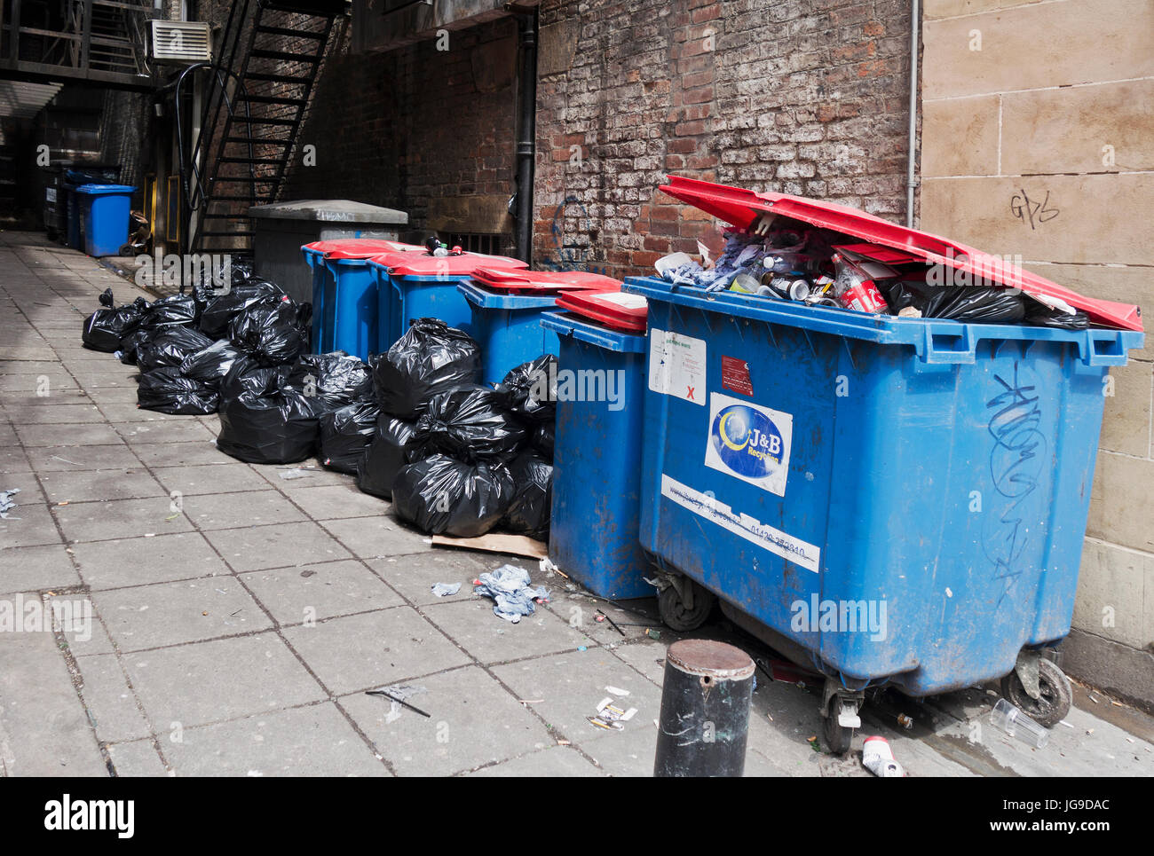 Overflowing dustbin and refuse outside a Newcastle public house Stock ...