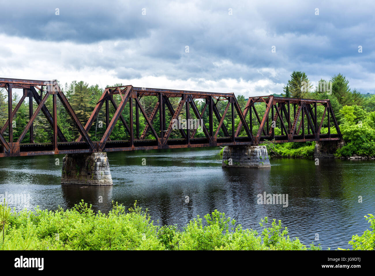 An old train bridge crossing a river Stock Photo - Alamy