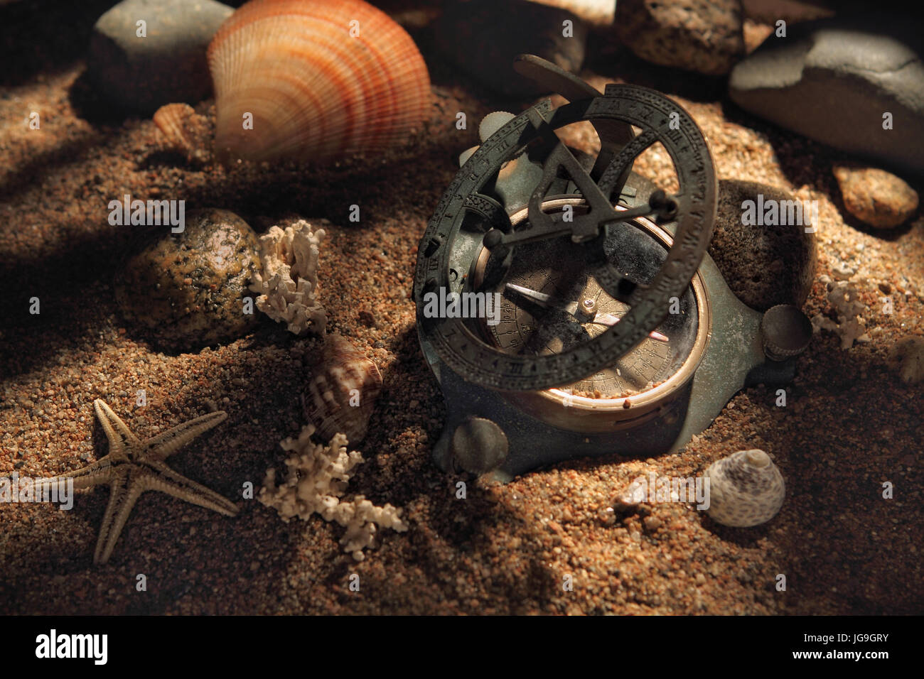 Ancient compass on the ocean floor. Near the starfis Stock Photo - Alamy