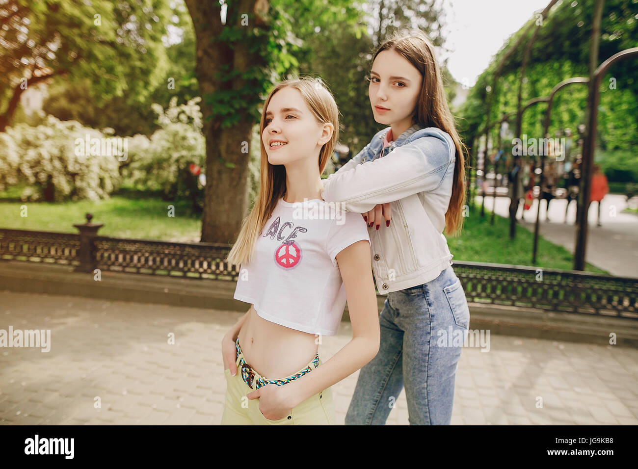 beautiful models pose for a photo in trendy clothes Stock Photo - Alamy