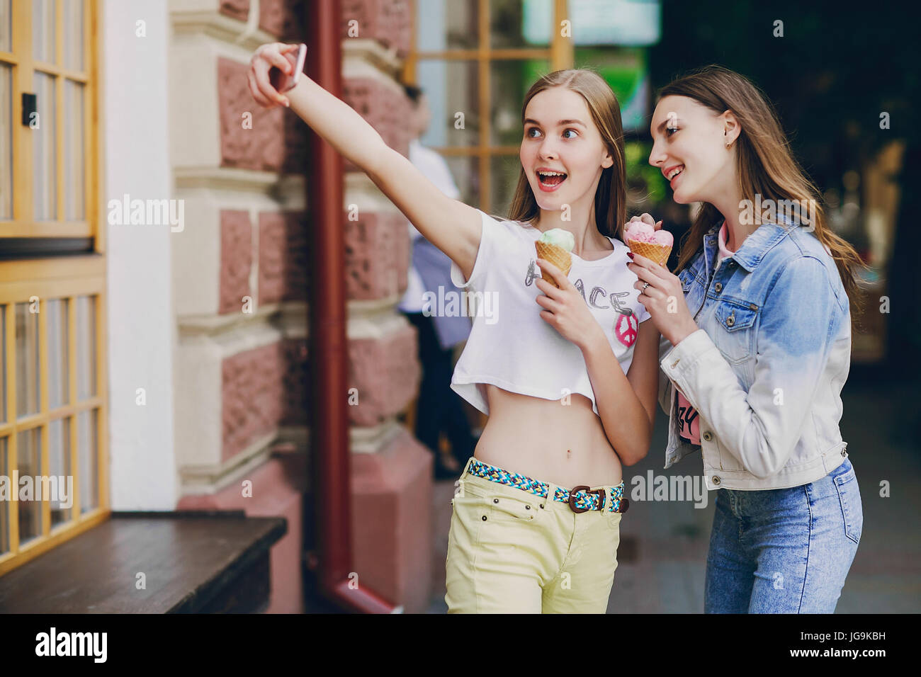 beautiful models pose for a photo in trendy clothes Stock Photo - Alamy