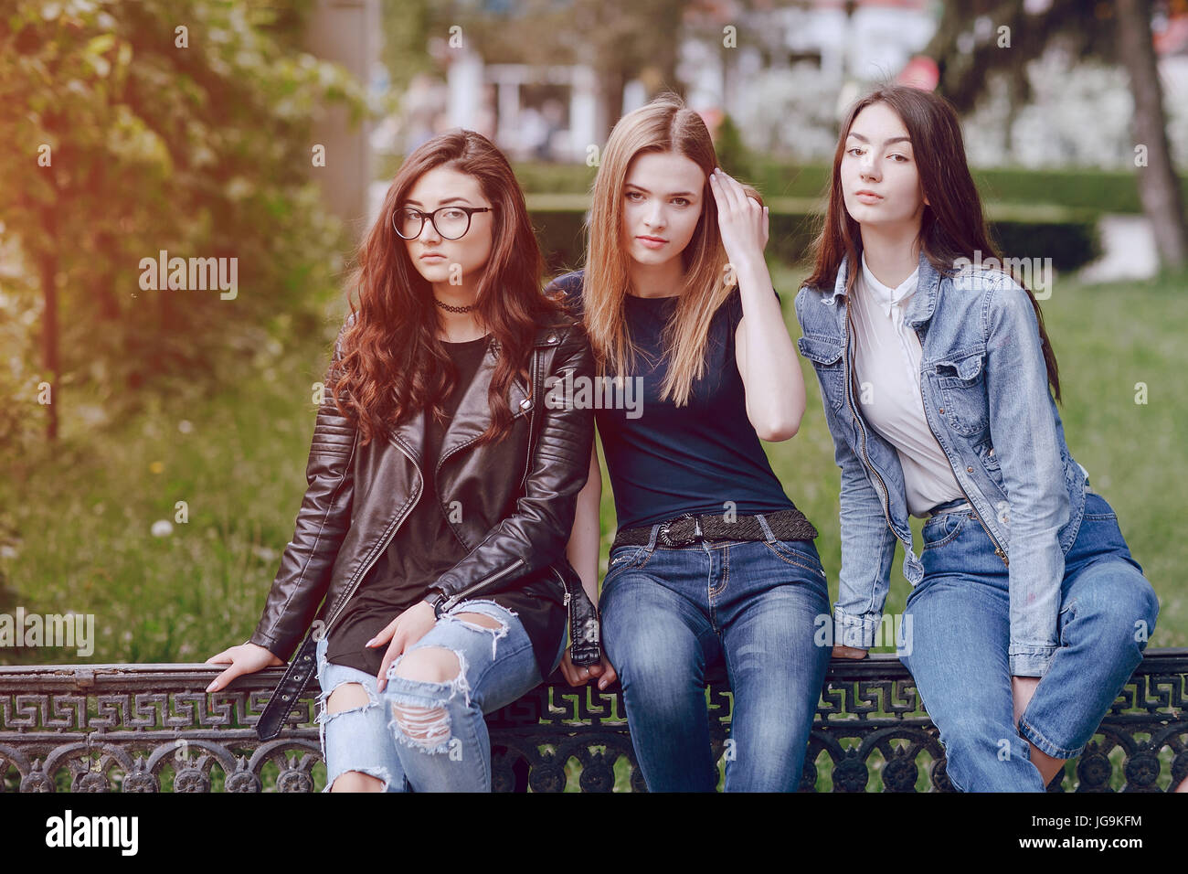stylish young model walk in the street and pose for a photo on a Sunny ...