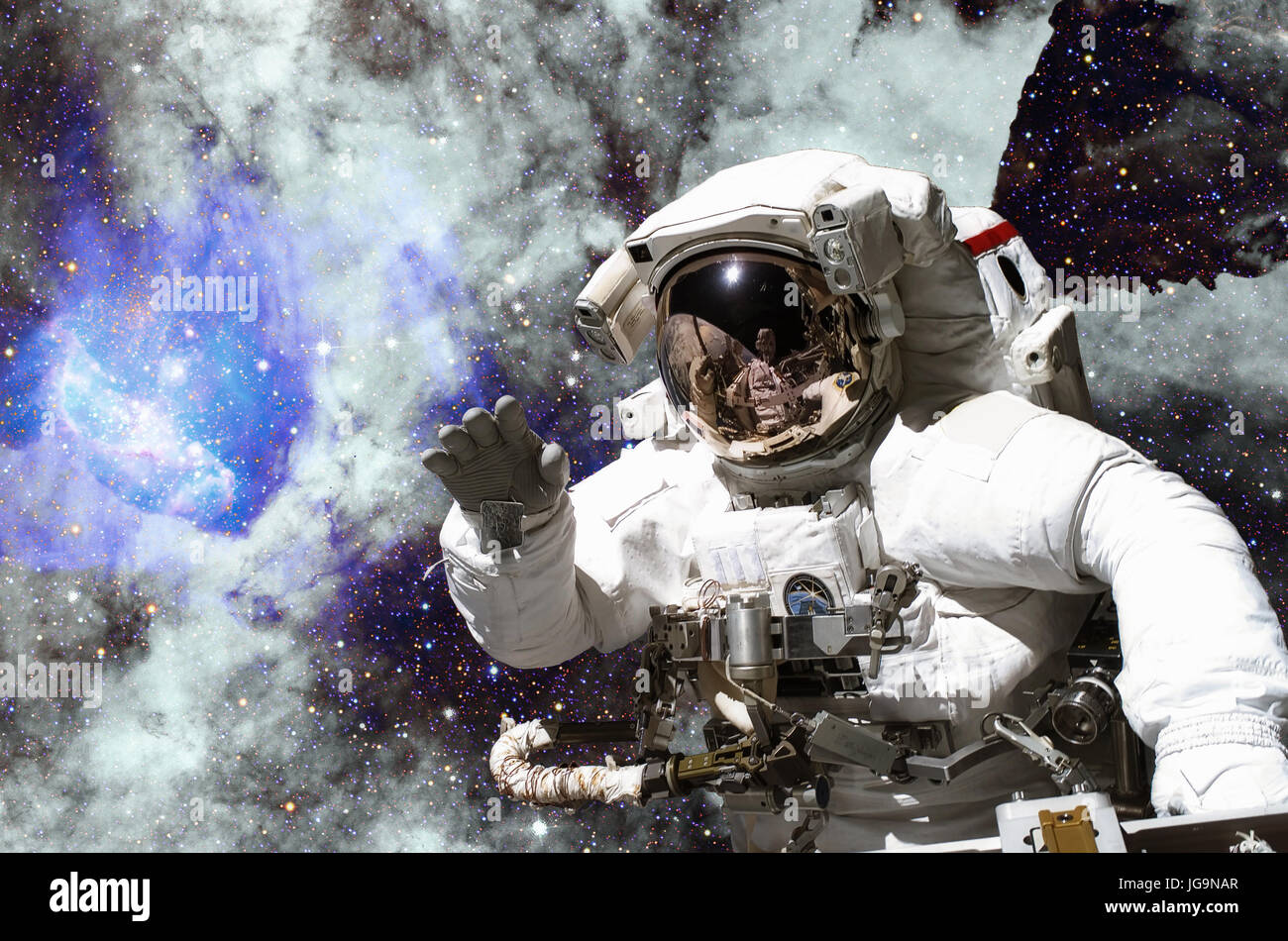 Astronaut in outer space. Galaxy and stars on the background. Elements ...