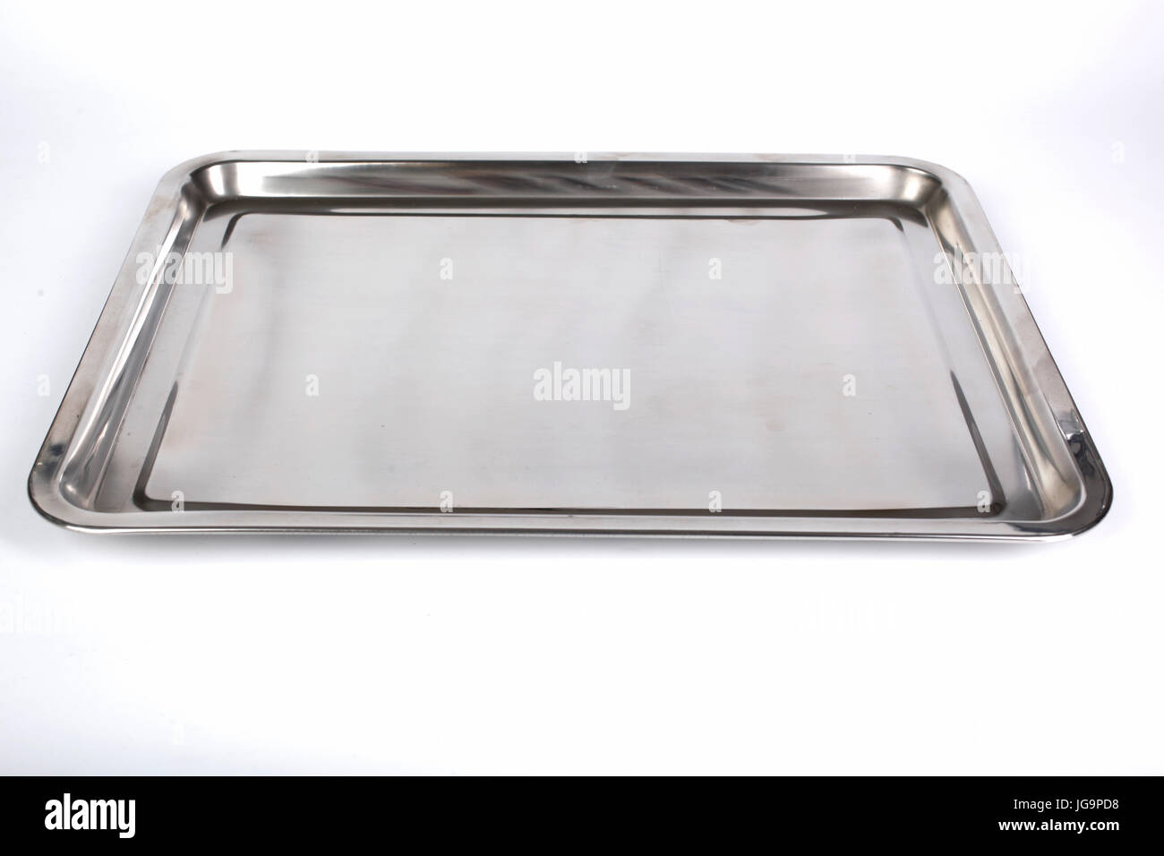 Metal backing tray on white background Stock Photo - Alamy