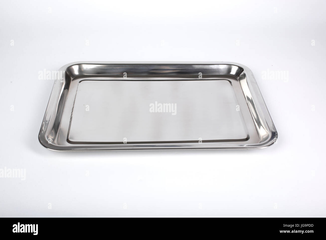 Metal backing tray on white background Stock Photo - Alamy