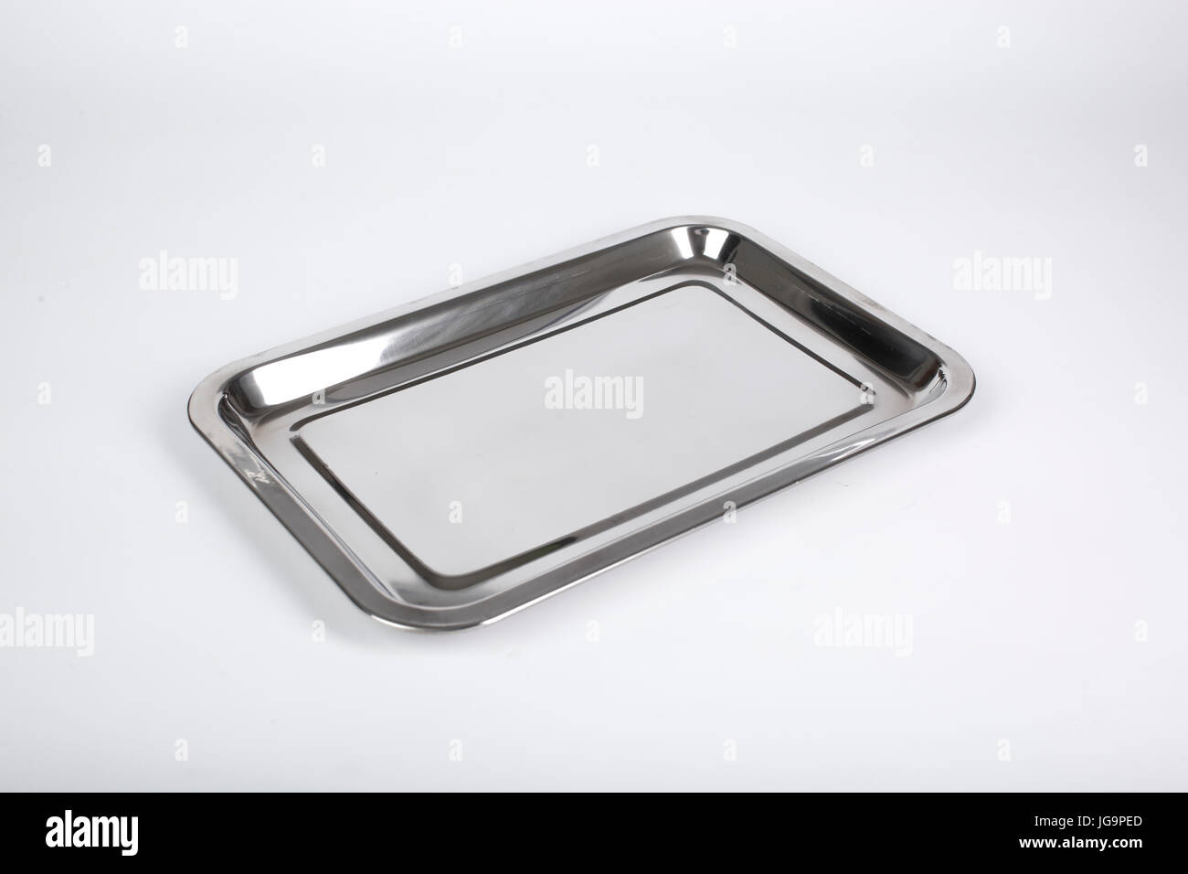 Metal backing tray on white background Stock Photo - Alamy