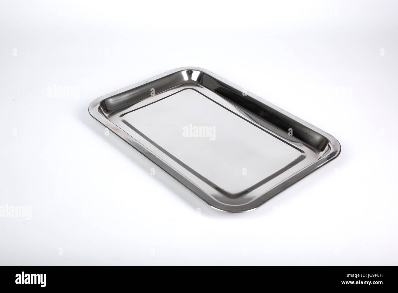 Metal backing tray on white background Stock Photo - Alamy