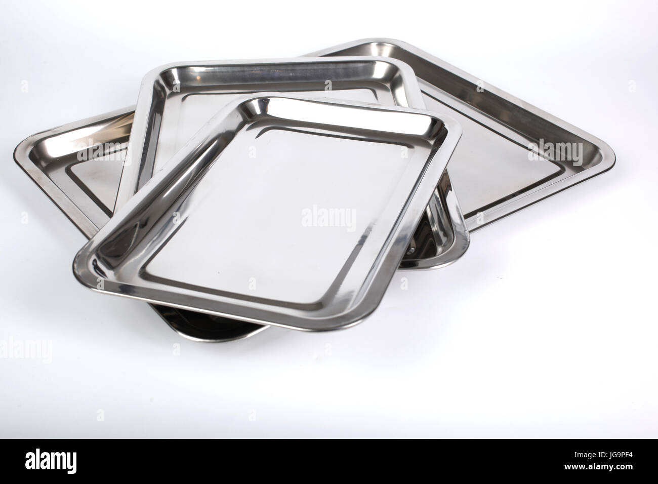Set of three metal backing trays on white background Stock Photo - Alamy