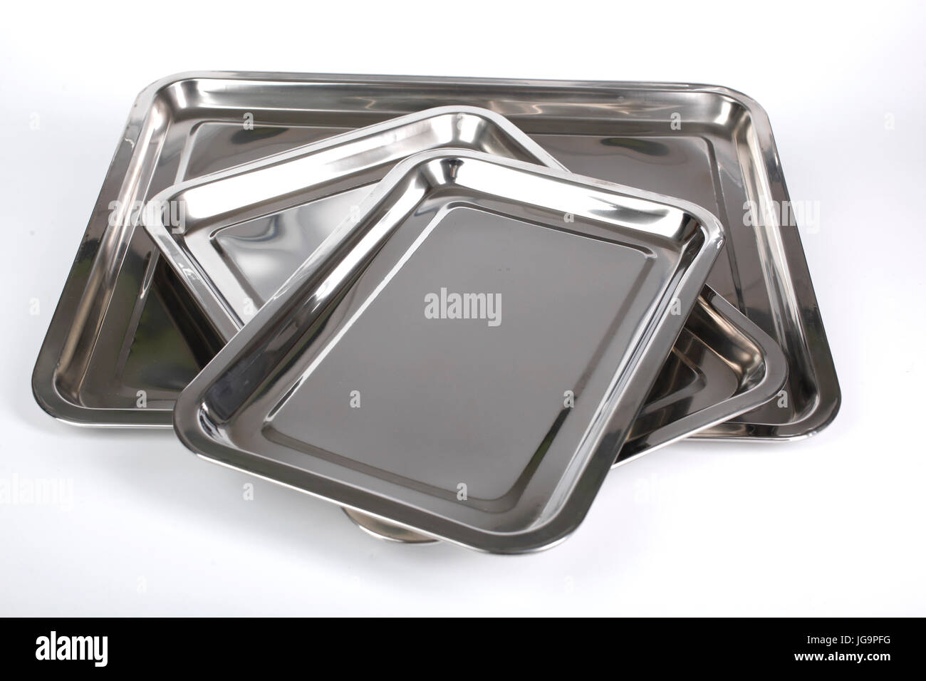 Set of three metal backing trays on white background Stock Photo - Alamy