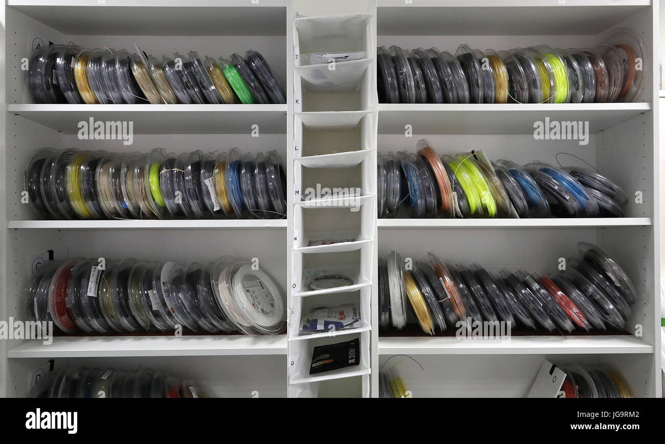 Players newly racketed strings on shelves in the Stringing Room on day ...