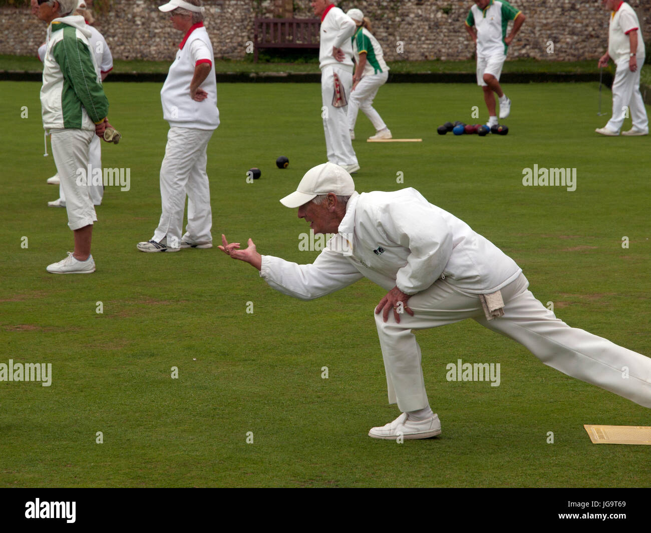 A game of bowls being played on the bowling green in the village of ...