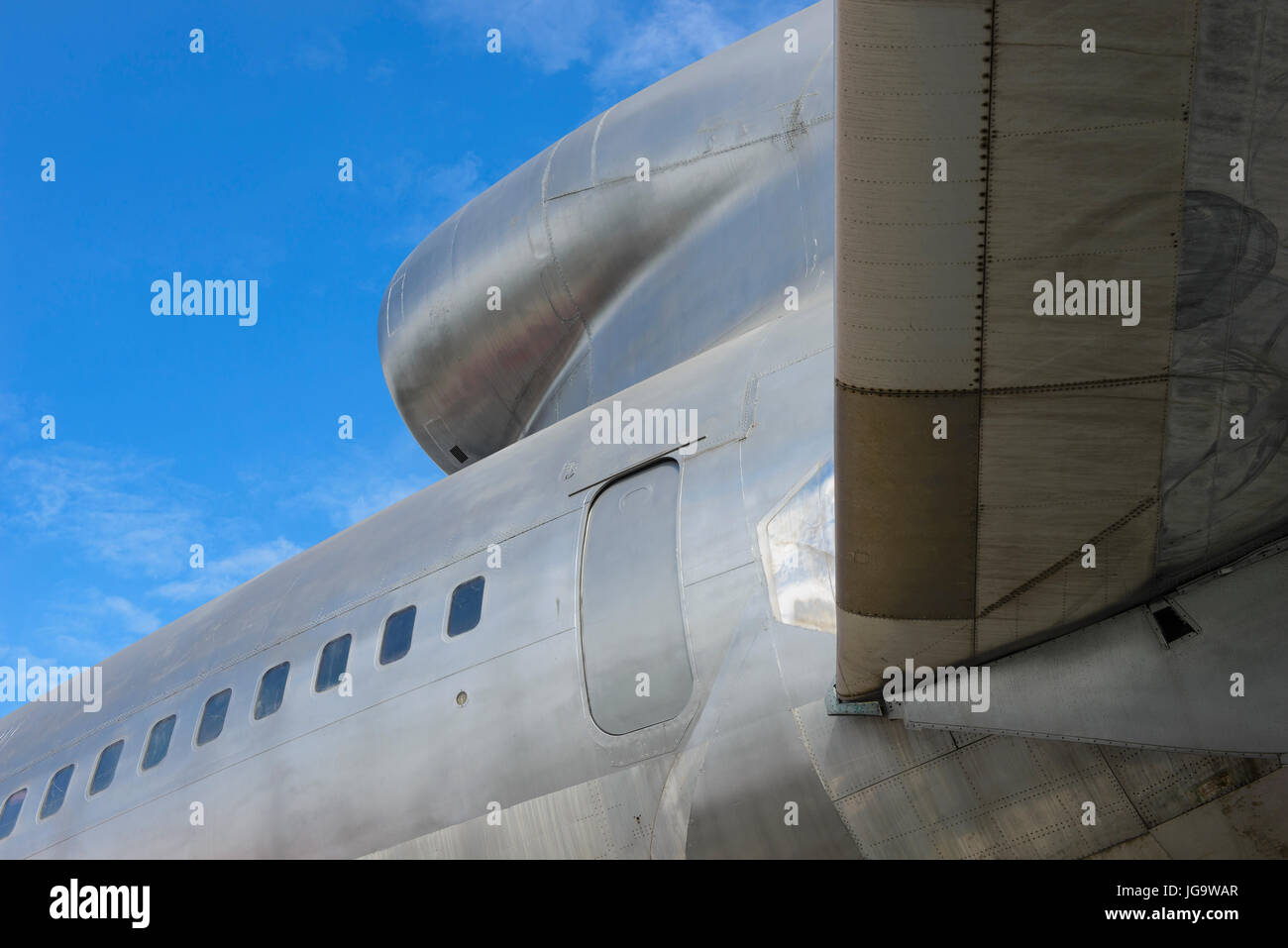 Rear view of old commercial airplane with blue sky Stock Photo - Alamy