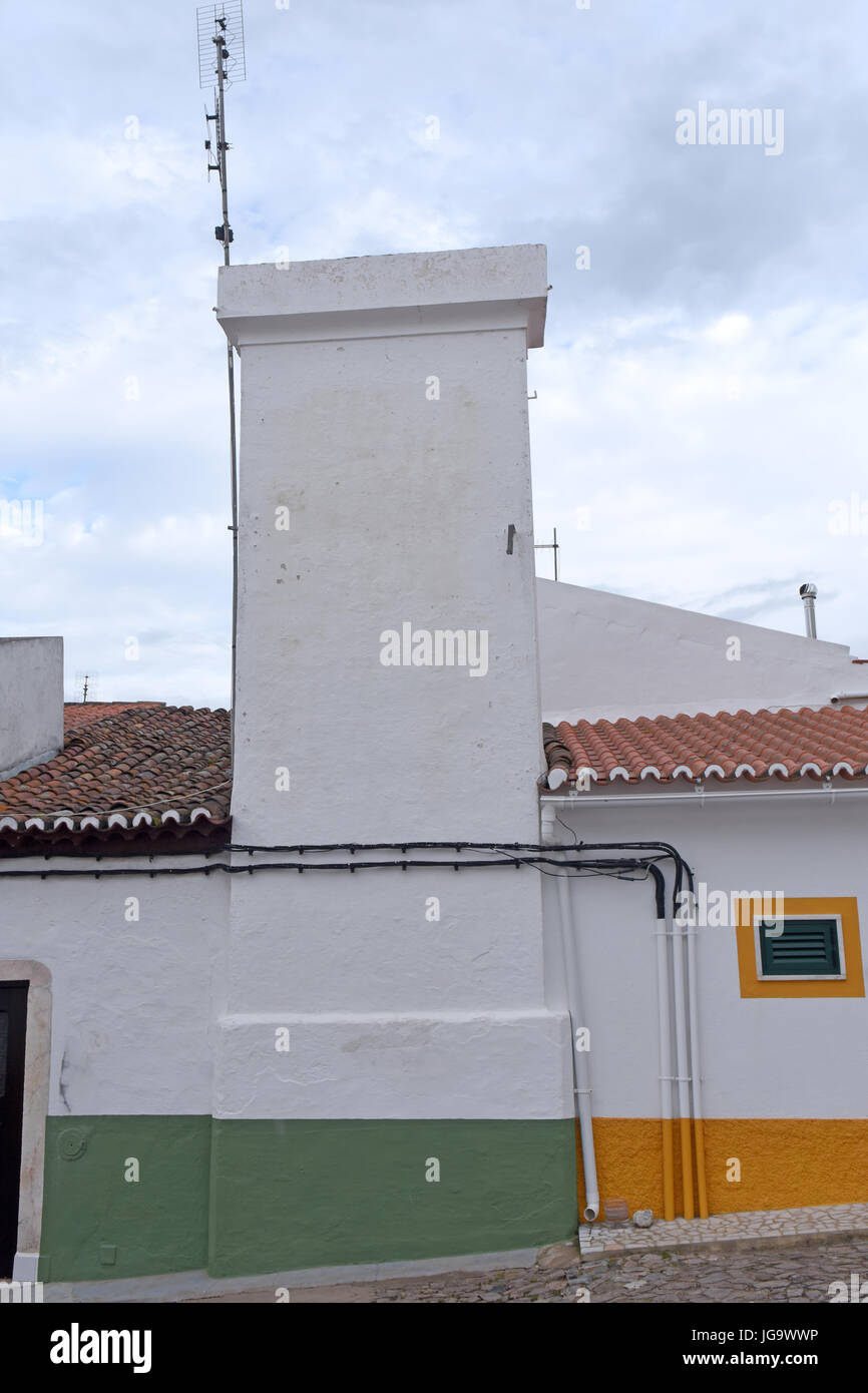 Street in Veiros with fireplace to dry sausages, Alentejo region ...
