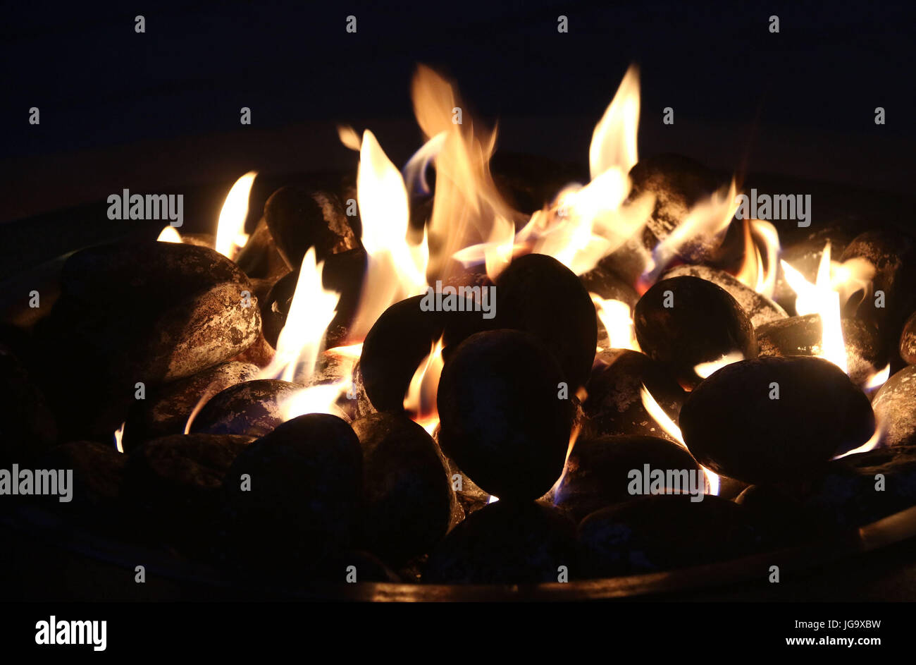 Glowing fire pit in the evening Stock Photo - Alamy