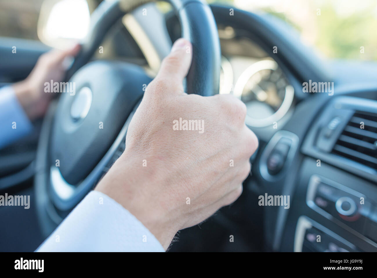 young driver driving car Stock Photo - Alamy