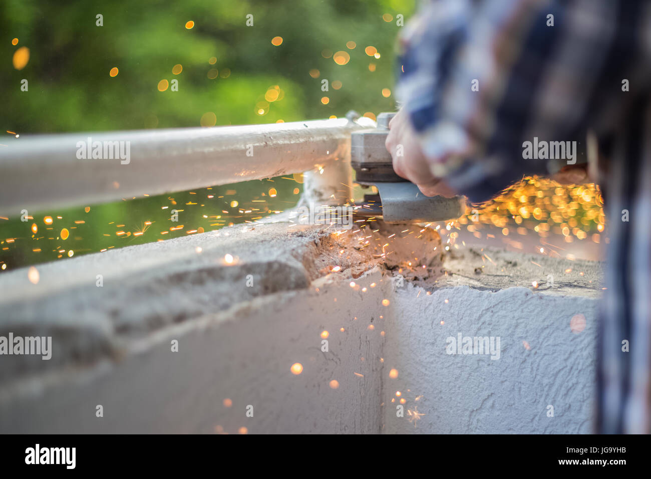 Master, cutting metal grinder, sparks everywhere, high speed rotating ...