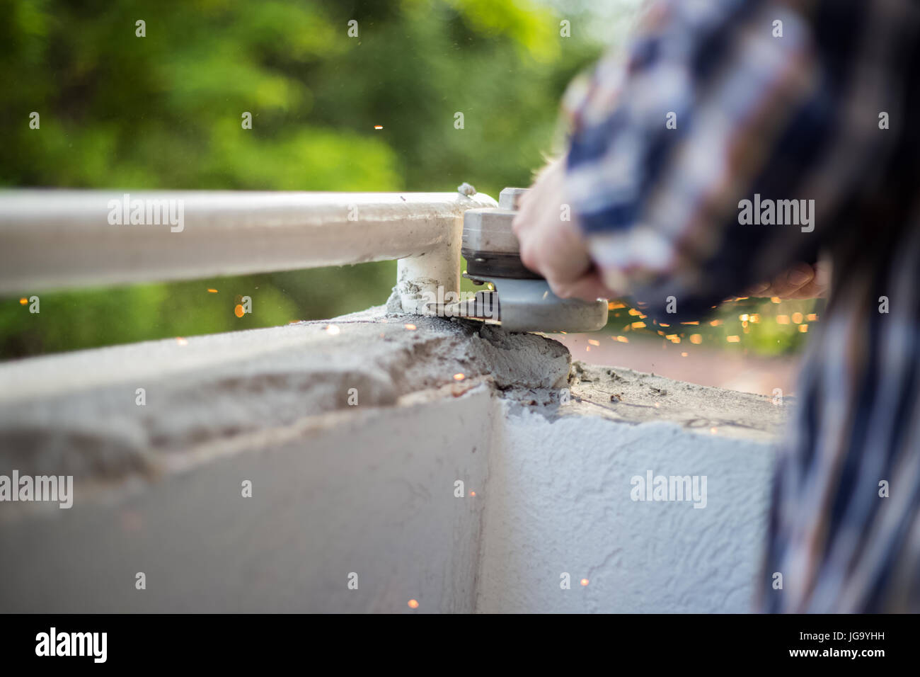 Master, cutting metal grinder, sparks everywhere, high speed rotating ...