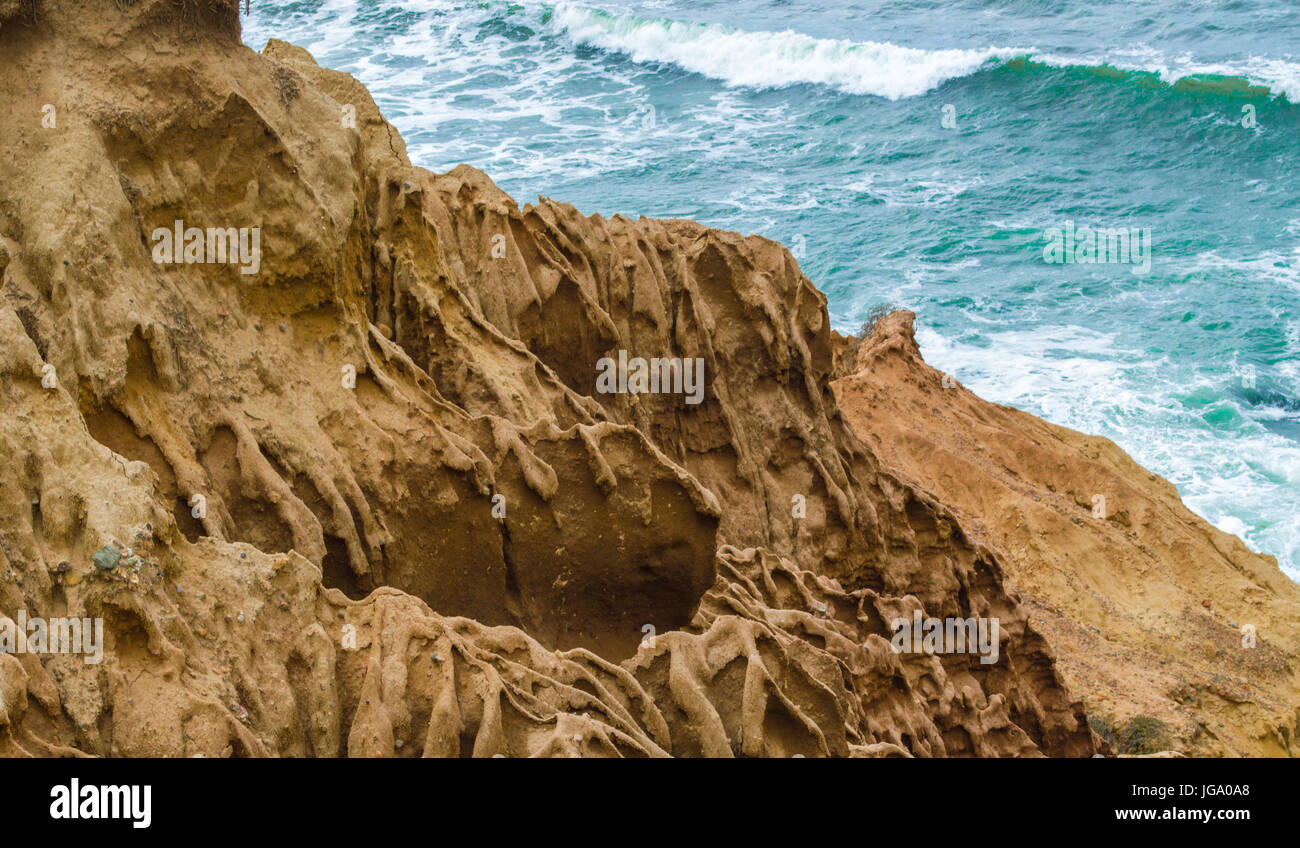 flowing sand cliff on Pacific Ocean in San Diego, California Stock ...