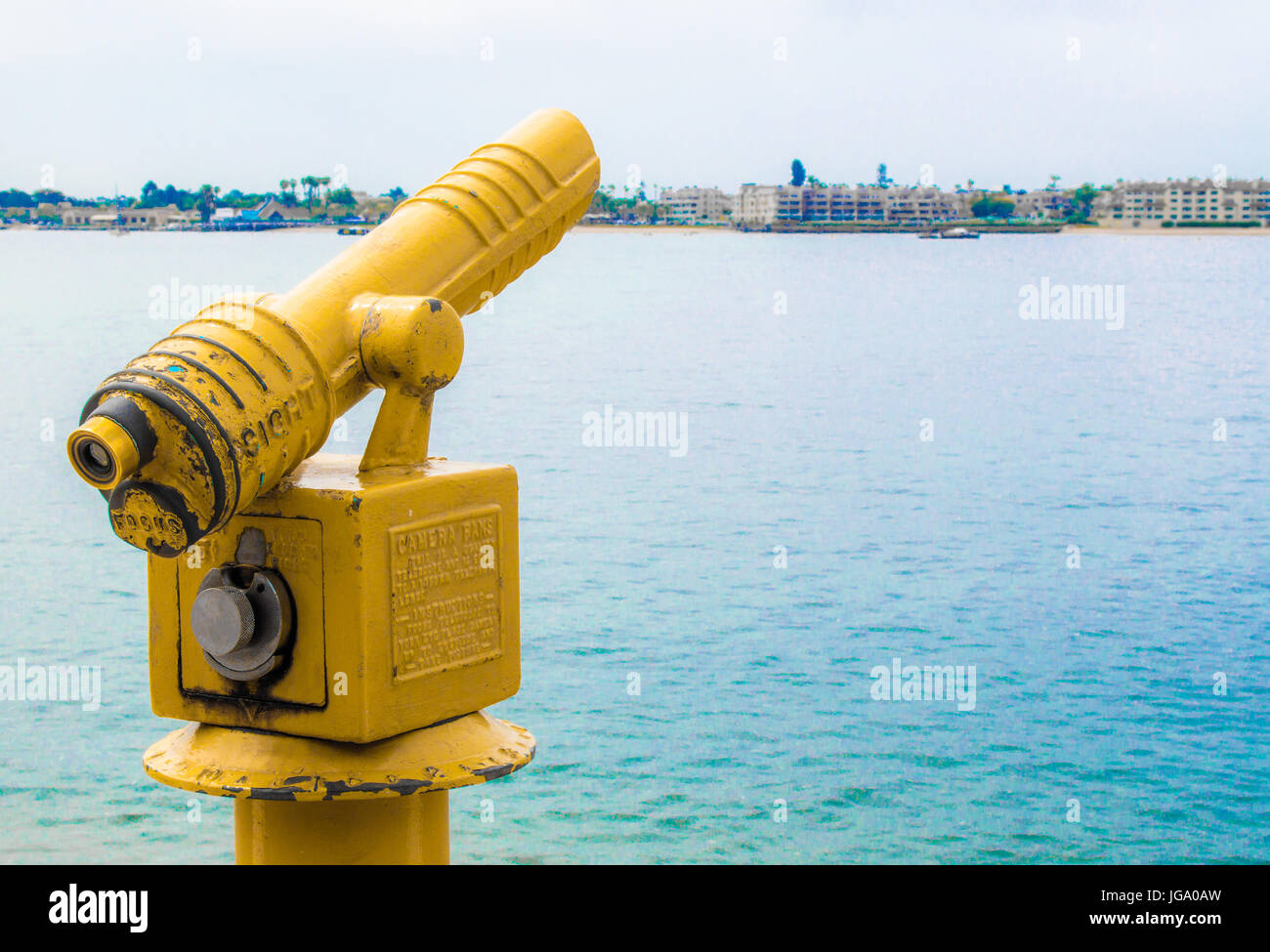yellow sightseeing telescope viewer looking across bay Stock Photo - Alamy