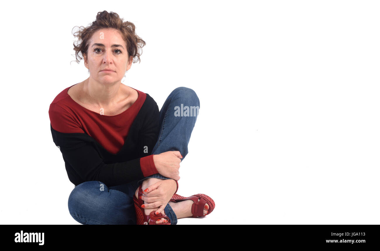 Woman crouching on a white background Stock Photo - Alamy