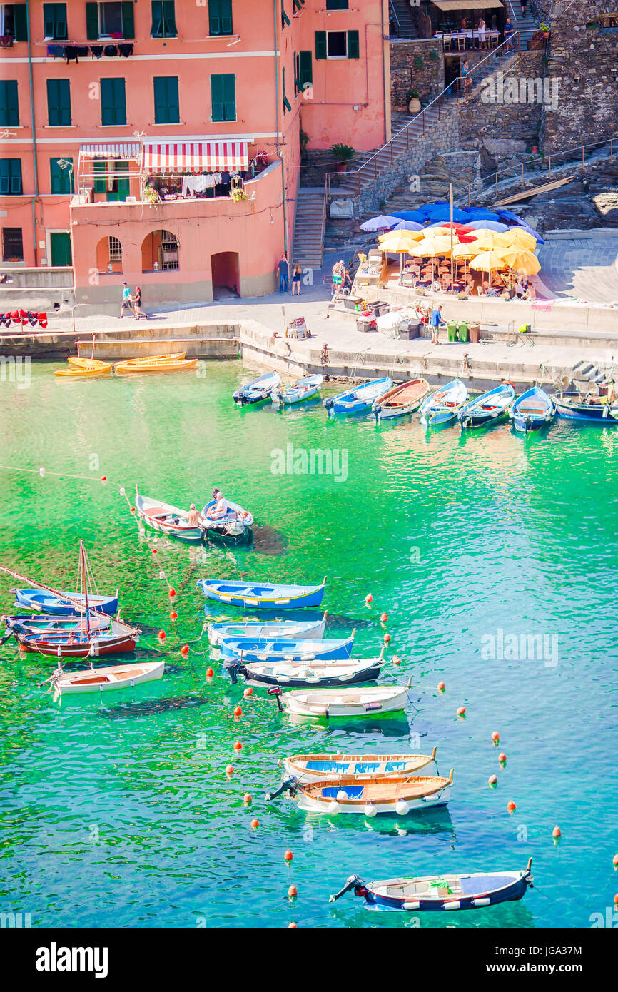 Beautiful cozy bay with boats and clear turquoise water in Italy ...