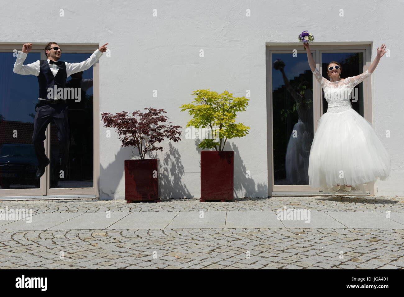 Happy wedding jumping groom hi-res stock photography and images - Alamy