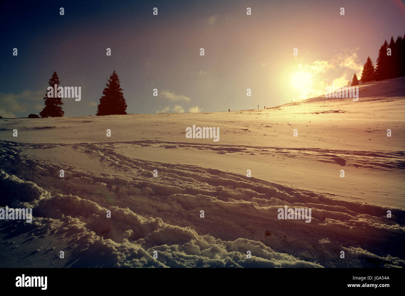 Winter landscape with setting sun Stock Photo - Alamy