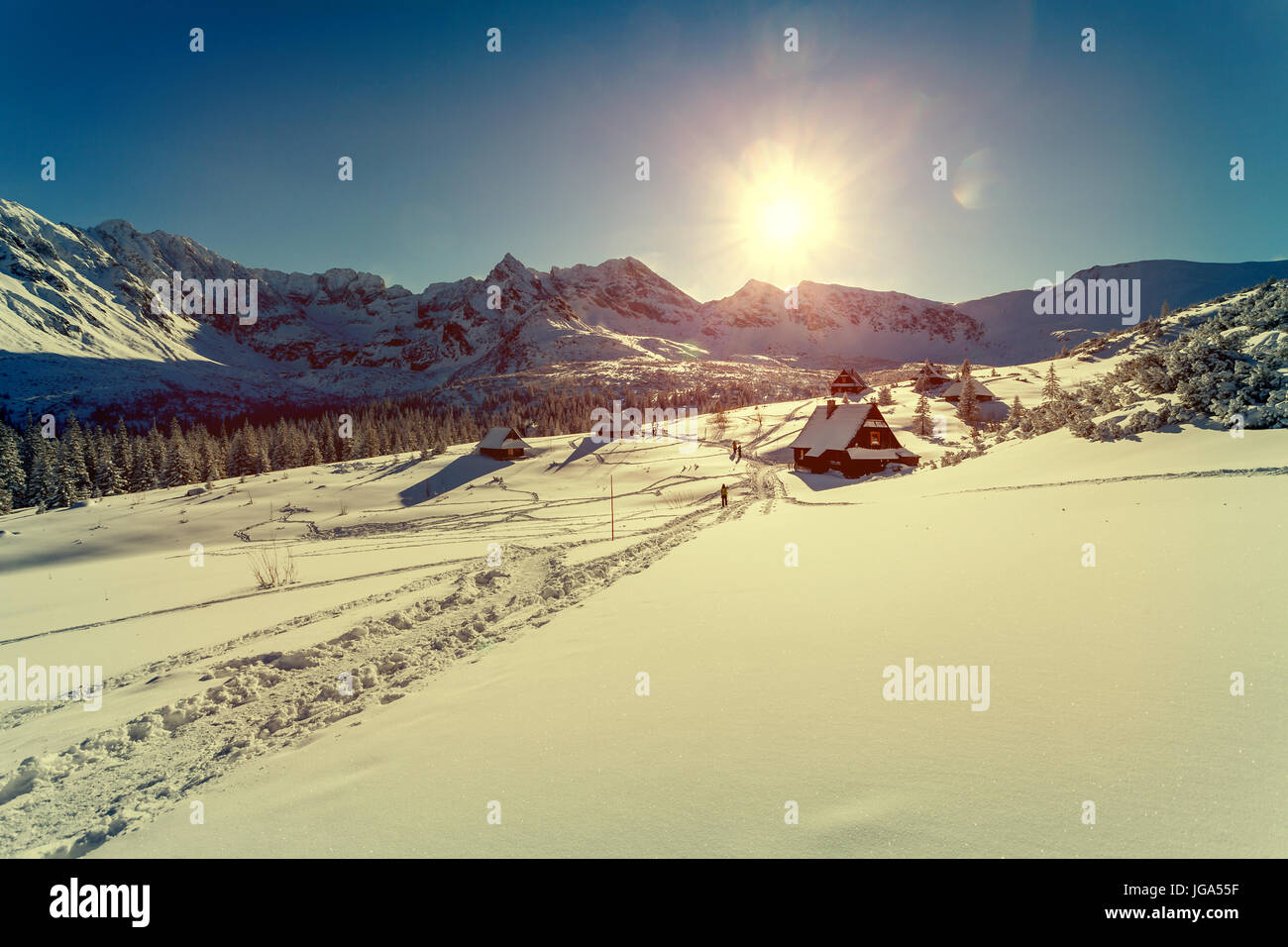 Winter landscape with setting sun Stock Photo - Alamy
