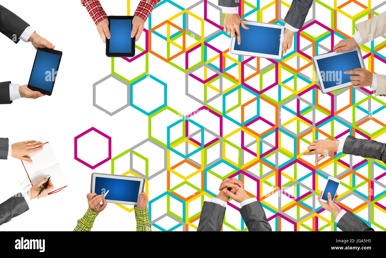 Group of people with devices in hands working together as symbol of ...