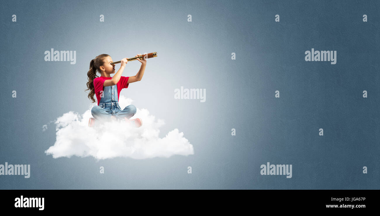 Cute kid girl on cloud looking in spyglass Stock Photo - Alamy