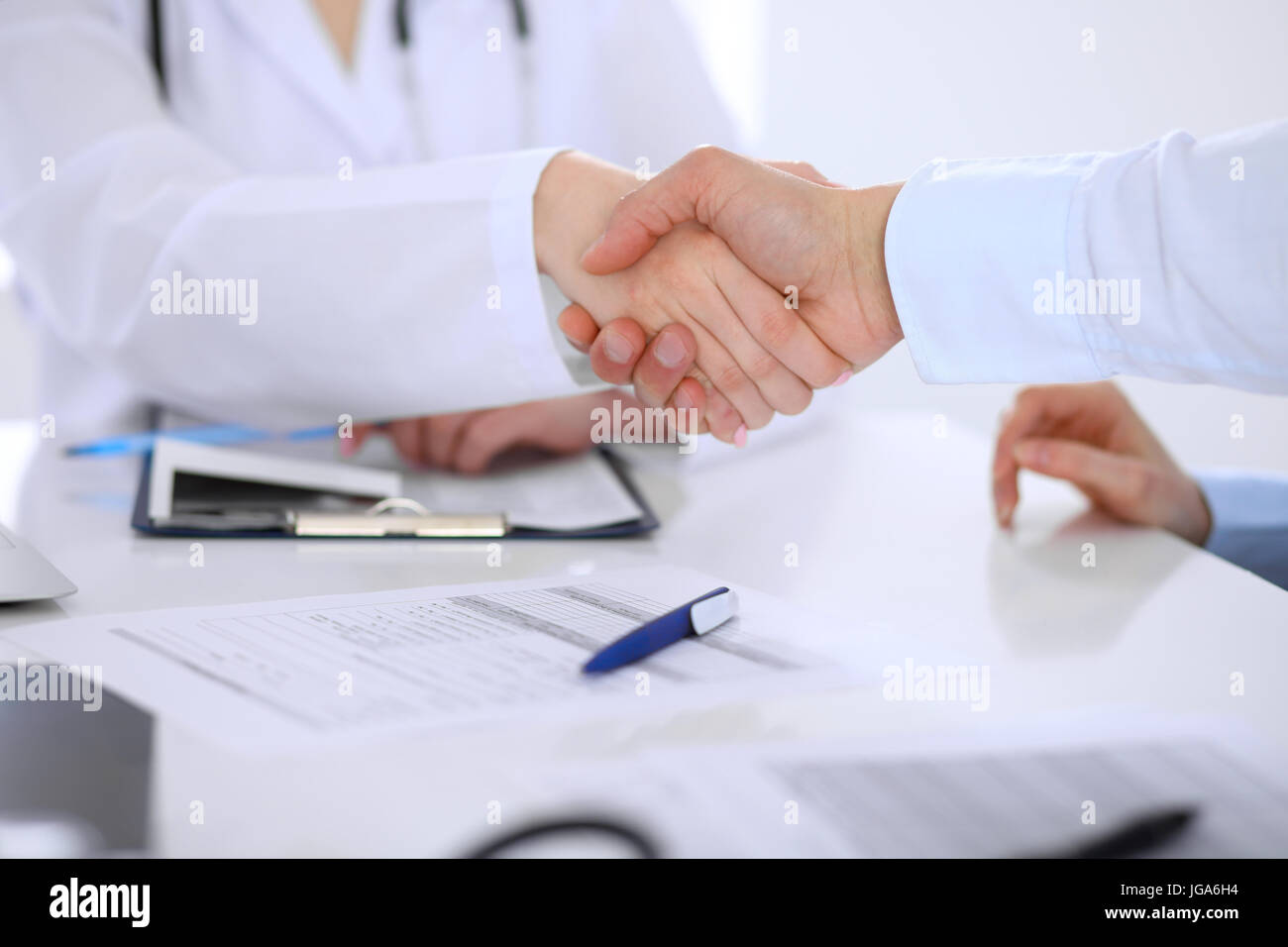 Doctor and patient handshaking. Hands close-up Stock Photo - Alamy