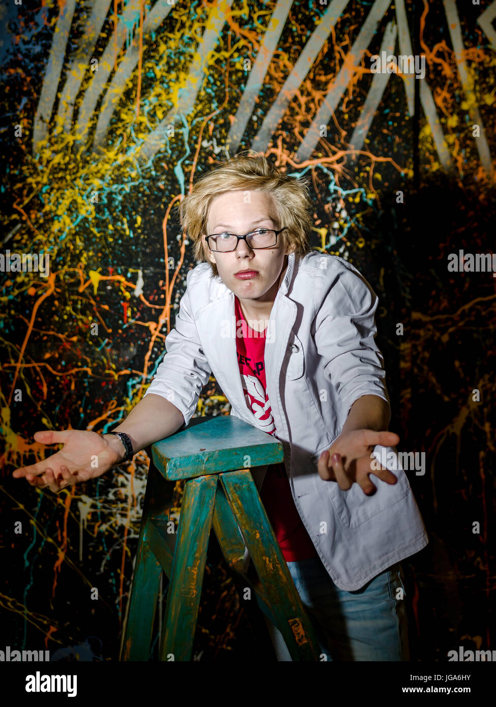 Funny teenage boy posing like a crazy professor or student, expressive ...