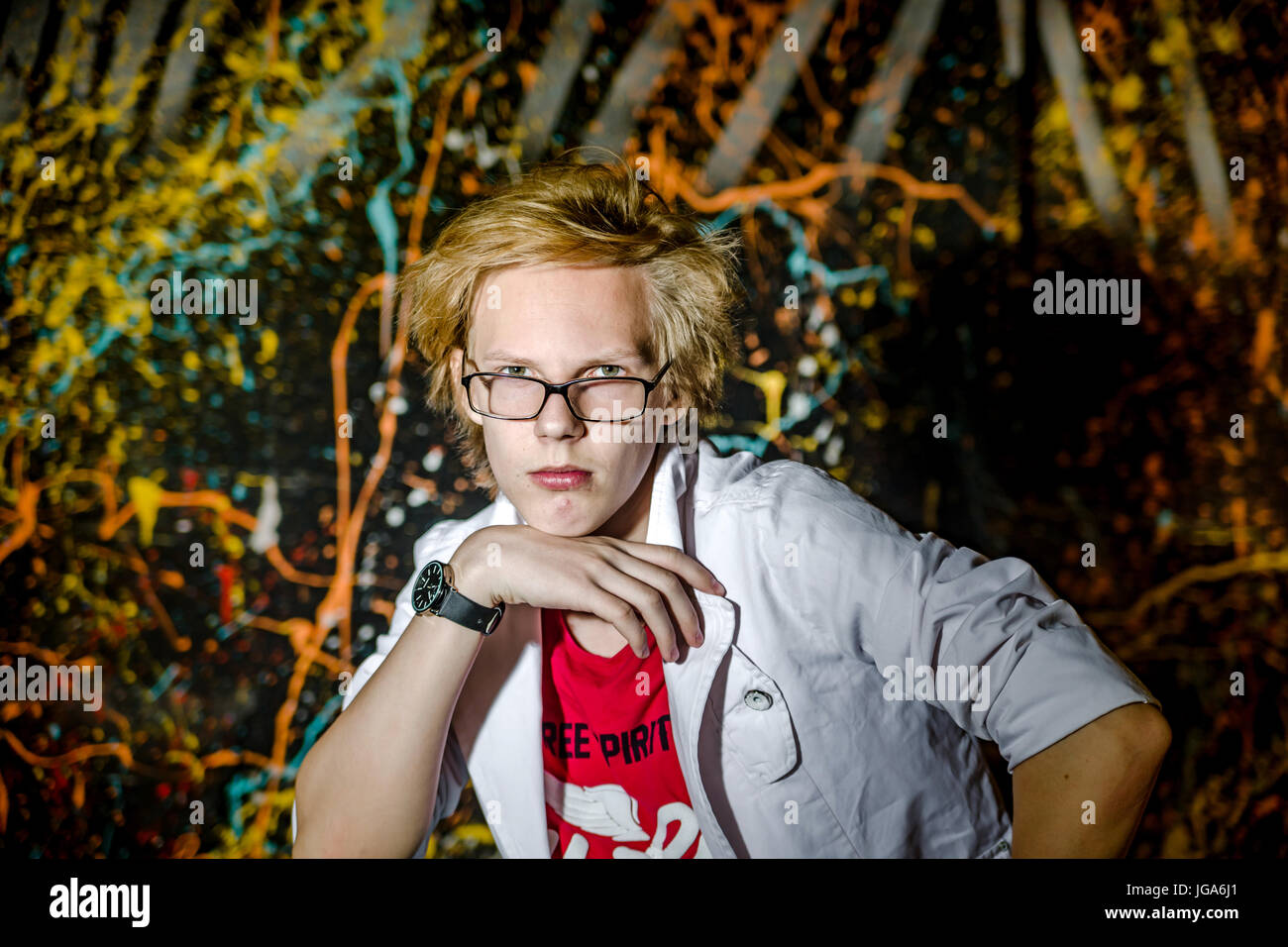 Funny teenage boy posing like a crazy professor or student, expressive ...