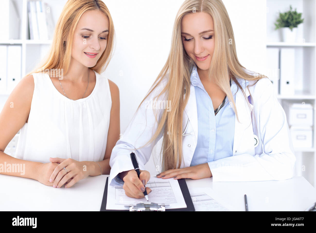 Doctor with patient in hospital Stock Photo - Alamy