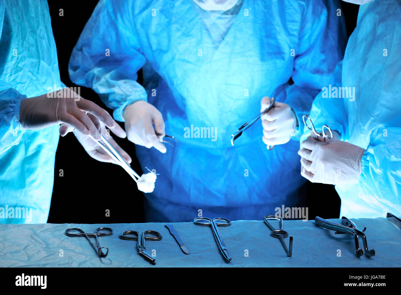 Medical team performing operation. Group of surgeon at work in ...