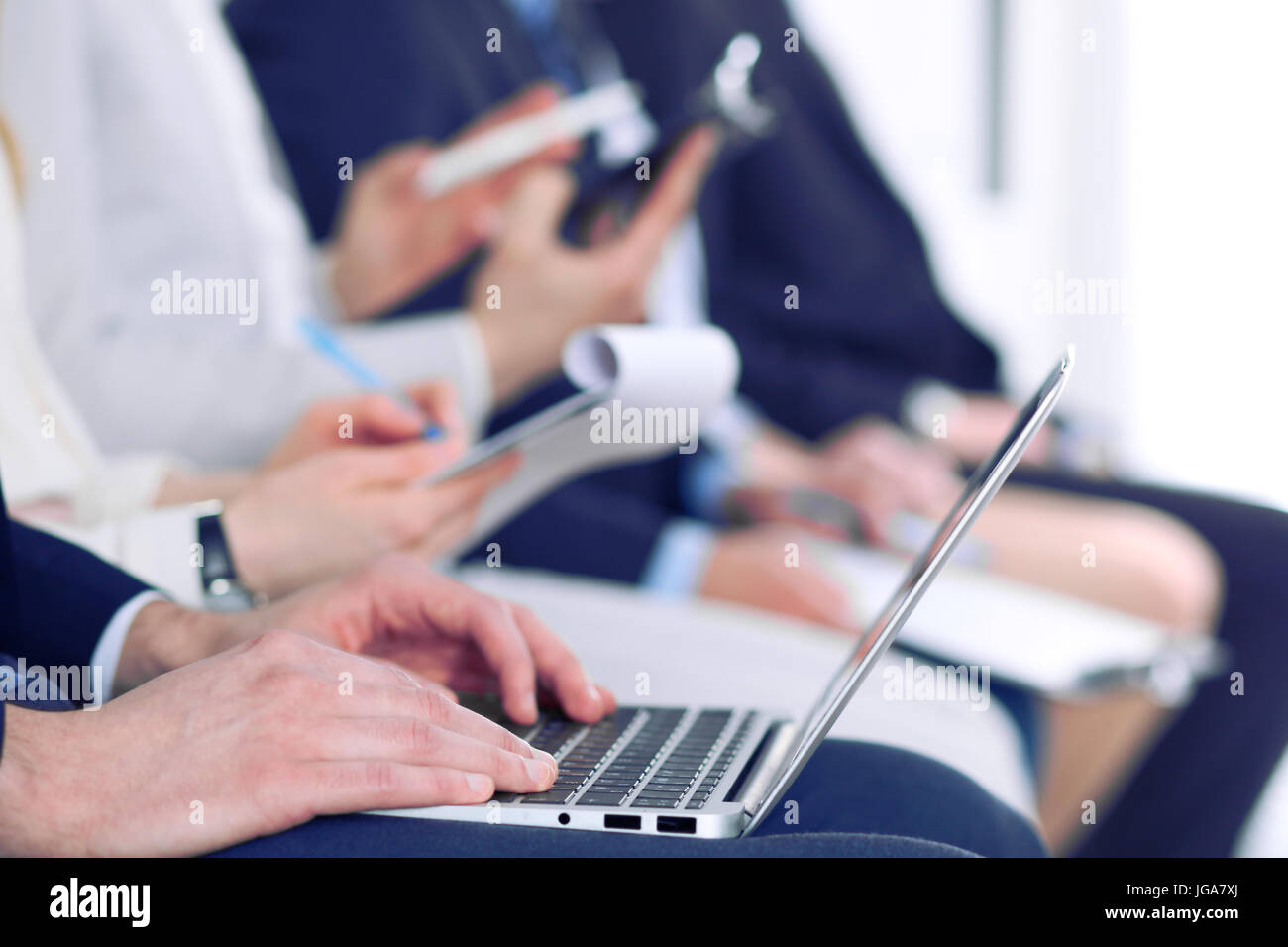 Close-up of business man hands typing on laptop computer at the ...