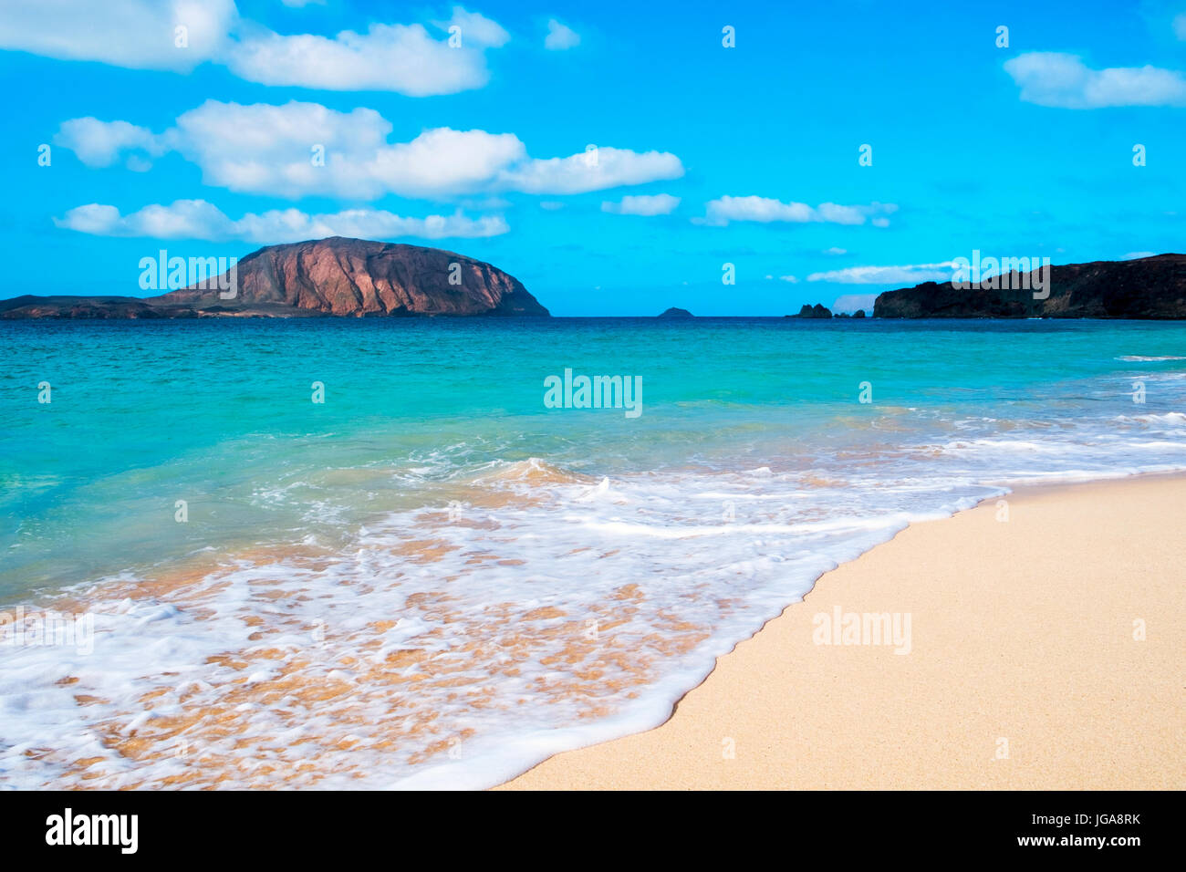 a view of the white sand of Playa de la Conchas beach in La Graciosa ...