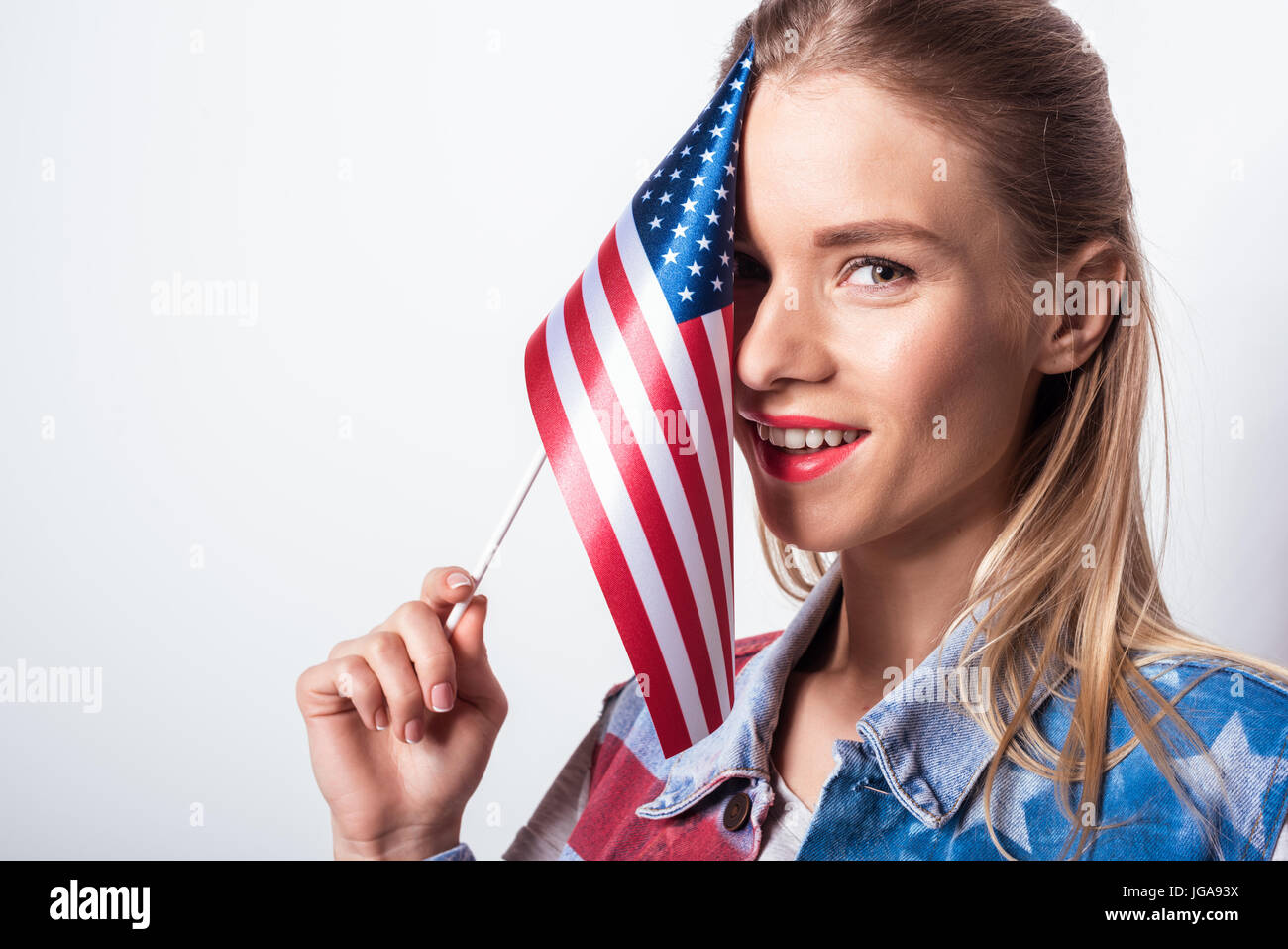 Beautiful young woman holding us hi-res stock photography and images ...