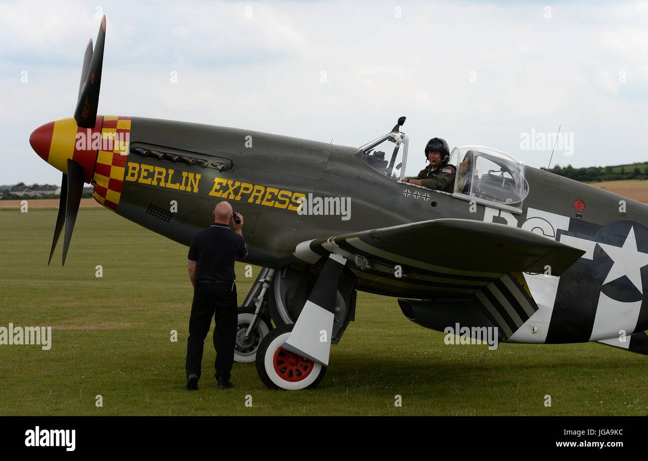 Pilot Lee Lauderback in the cockpit of a P-51 Mustang Berlin Express at ...