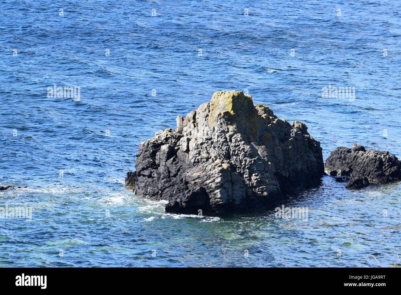 Large rocks in sea Stock Photo - Alamy