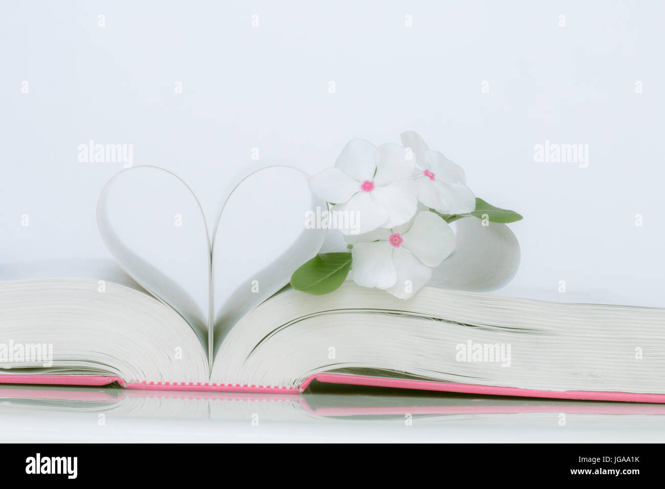 Heart from pages of the book Stock Photo - Alamy
