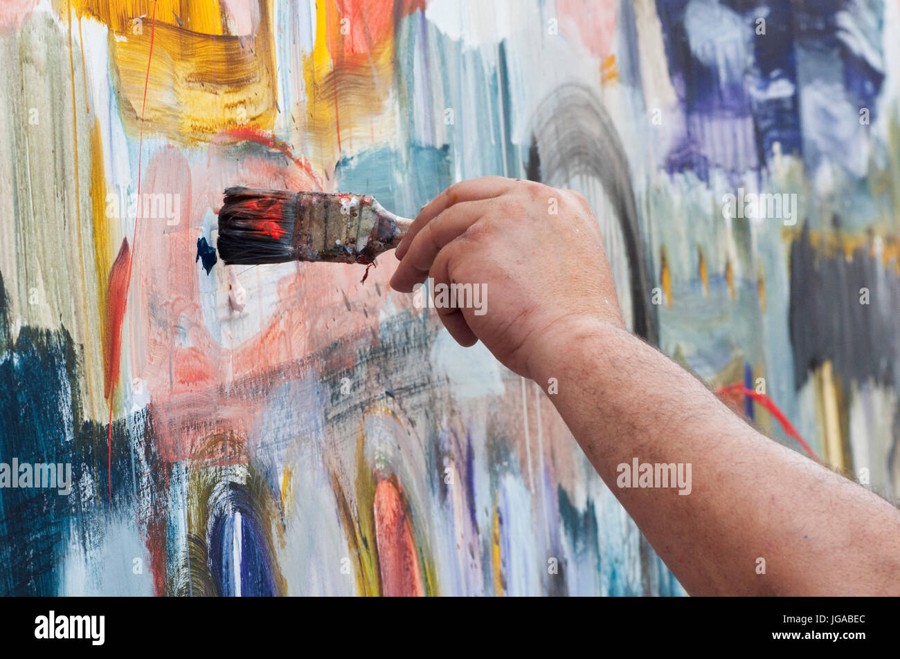 Male artist holding painting hi-res stock photography and images - Alamy